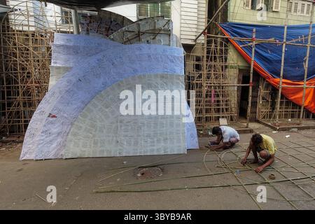 Workers making decoration for Pandal (Temporary place of Worship) for ...