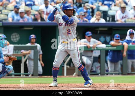 New York Mets' Luisangel Acuña (2) hits a sacrifice bunt in the third ...