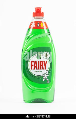 Fairy washing up liquid on a sink draining board with cups and cutlery ...