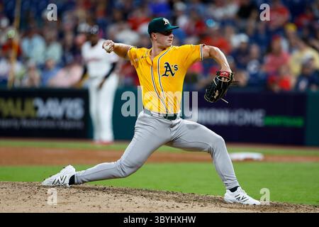 Athletics pitcher Jack Perkins throws to a Texas Rangers batter during ...