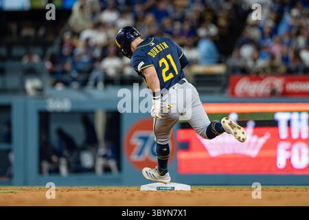 Milwaukee Brewers' Caleb Durbin rounds the bases after hitting a solo ...
