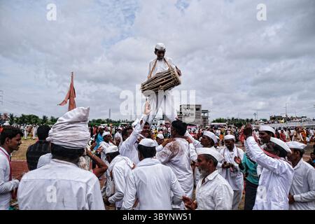 Devotees participate in the vibrant Wari Palki Yatra at Pandharpur, a ...