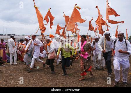 Devotees participate in the vibrant Wari Palki Yatra at Pandharpur, a ...