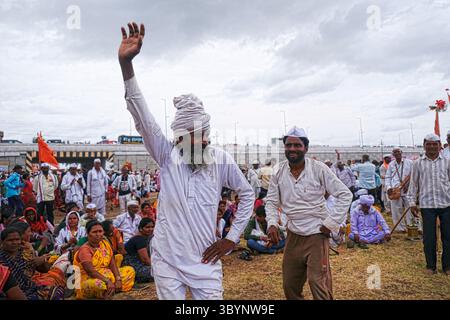 Devotees participate in the vibrant Wari Palki Yatra at Pandharpur, a ...