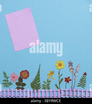 Dried Flowers on Blue Paper Background With Blank Greeting Card Stock ...