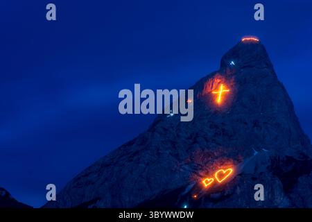 summer solstice landscape of alps. day meet night. sun and moon over ...