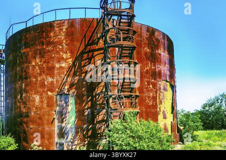 Old rusty oil tanks (fuel reservoir, oil barrel). Evidence of economic ...