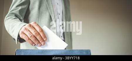 hand putting vote in ballot USA elections Stock Photo - Alamy