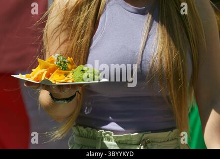 A female holding a guacamole Stock Photo - Alamy