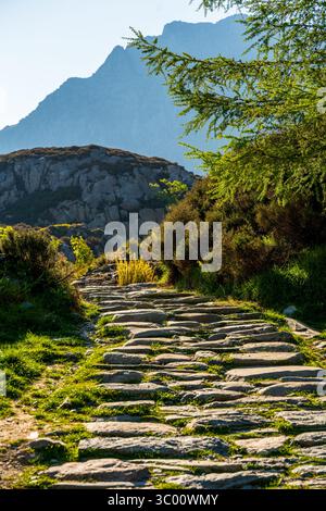 A stone steps trail in a mountainous area, with stone walls Stock Photo ...
