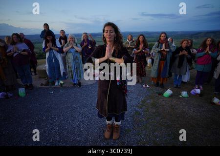 People surround Magdalene Rose Priestess, Chloe Mercer on the ...