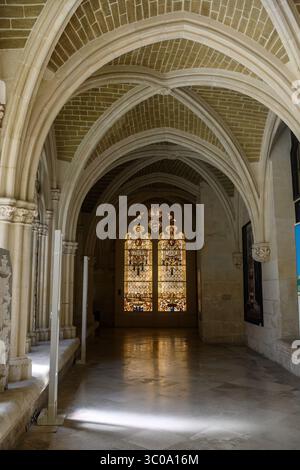 Gothic cathedral archway with ribbed vaulting and ornate stonework in ...