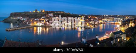 View of Whitby Harbour at night Stock Photo - Alamy