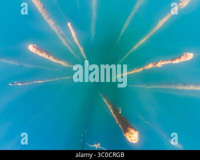 Deep underwater landscape in Rummu quarry with sun rays piercing ...