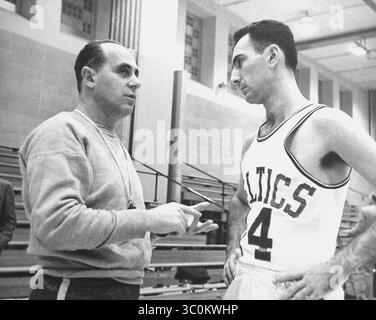BOSTON, MA - 1957: Bob Cousy #14 of the Boston Celtics shoots over ...