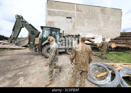 Marines and Latvian Engineers Cut Lumber for Trench Support - BALTOPS ...