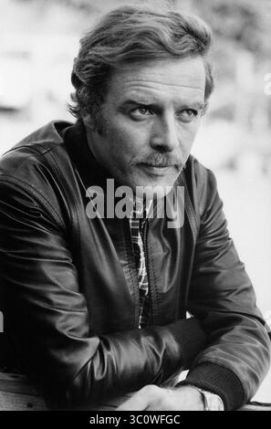 Italian actor Gianni Garko (Giovanni Garcovich) caressing a horse. Rome ...