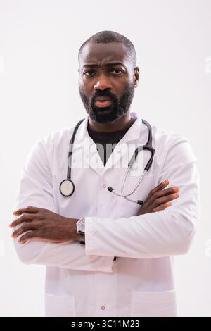 Portrait of handsome man doctor thinking and looking up Stock Photo - Alamy