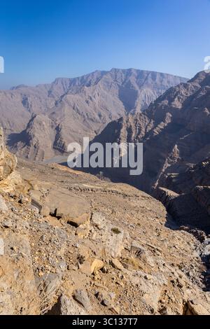 Wadi Ghalilah valley with dry riverbed and scattered farm houses ...