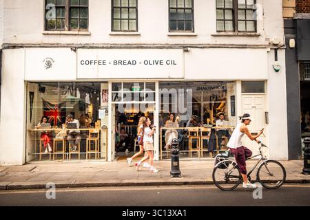 LONDON- JULY 16, 2025: A coffee shop cafe and people on the Kings Road ...