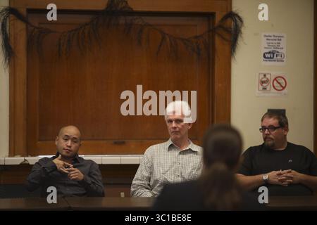 An American Sign Language interpreter, right, signs as President Donald ...