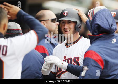 Seattle Mariners' Mitch Garver celebrates in the dugout after hitting a ...