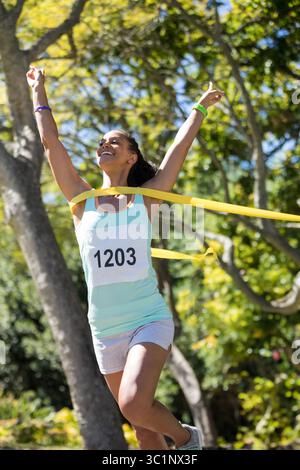 african american woman running across the bridge Stock Photo - Alamy
