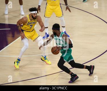 Boston Celtics guard Jaylen Brown shoots against the Portland Trail ...