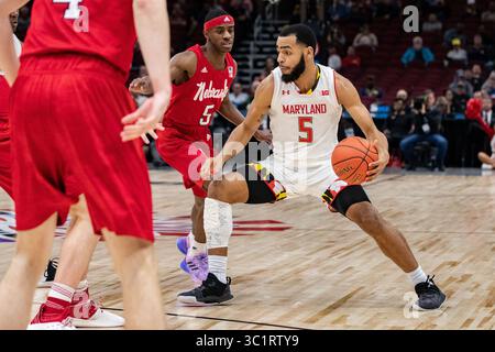 Maryland guard Eric Ayala dribbles up court against Nebraska during the ...