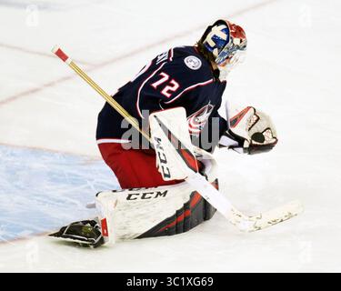 New York Islanders players and Columbus Blue Jackets warm up before an ...
