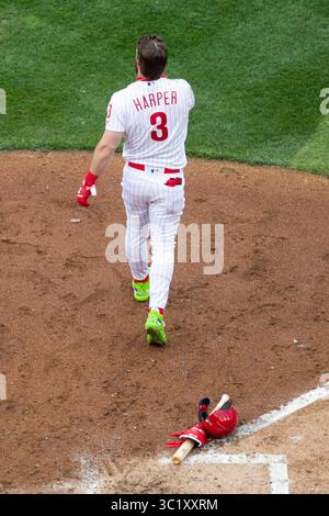 Philadelphia Phillies' Bryce Harper walks to the dugout after striking ...