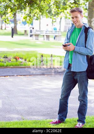 Paved path in the shade in a park Stock Photo - Alamy