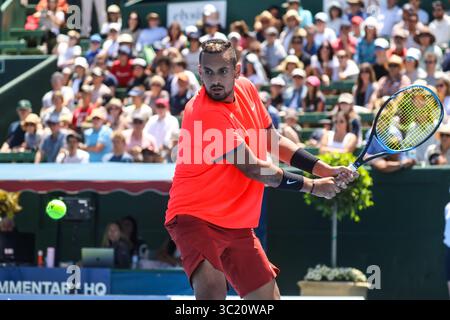 Bernard Tomic of Australia plays a backhand during match one of the ...