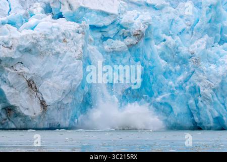 Collapsing ice wall of Fjortende Julibreen / 14th of July Glacier ...