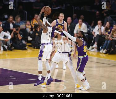 Los Angeles Lakers guard Kentavious Caldwell-Pope shoots next to Miami ...