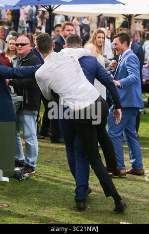 MELBOURNE, AUSTRALIA, NOVEMBER 2: Drunk punters at the end of Derby Day ...