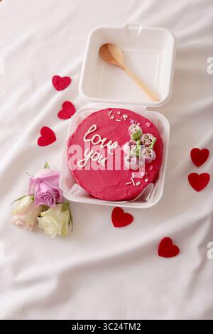 Box with heart-shaped bento cake on grey background. Valentine's Day ...