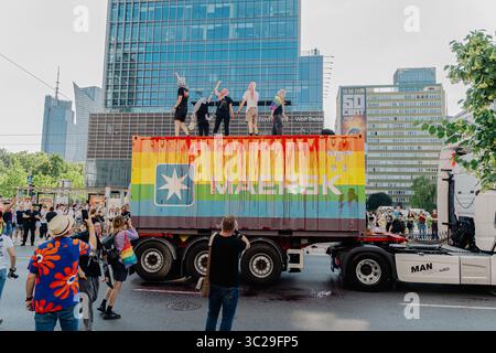 Protesters on top of the Maersk vehicle chant anti-genocide slogans ...