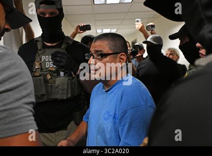 A person is detained by federal immigration officers on Lake Street in ...