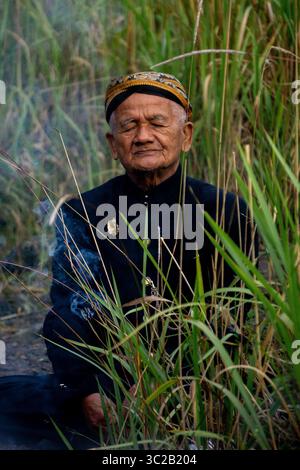 A group of Javanese on the hills and praying to the God at larungan ...