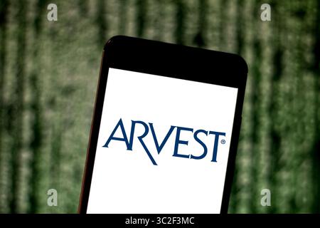 In this photo illustration, the Arvest Bank logo is displayed on a ...