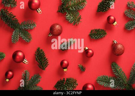 Stylish christmas fir branches with baubles and gift boxes on front of ...