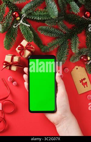 Digital smartphone, blank screen with small petals and white tangled ...