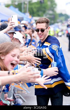 St. Louis Blues goalie Jordan Binnington, left, and Pius Suter, right ...