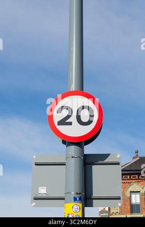 20 Miles per hour speed limit sign against a blue sky Stock Photo - Alamy