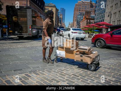 A UPS truck driver makes a delivery in Chicago, Tuesday, Oct. 28, 2025 ...
