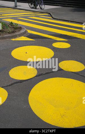 Yellow zones painted on the asphalt for pedestrian safety Stock Photo ...