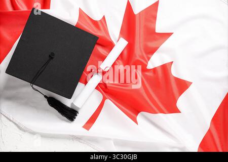 Graduation hat and diploma on Canadian flag Stock Photo - Alamy