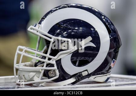 A Los Angeles Rams helmet sits on the sideline before an NFL football ...