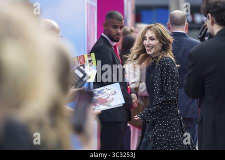 Erica Huggins (producer) in front of the film premiere of Die Nackte ...